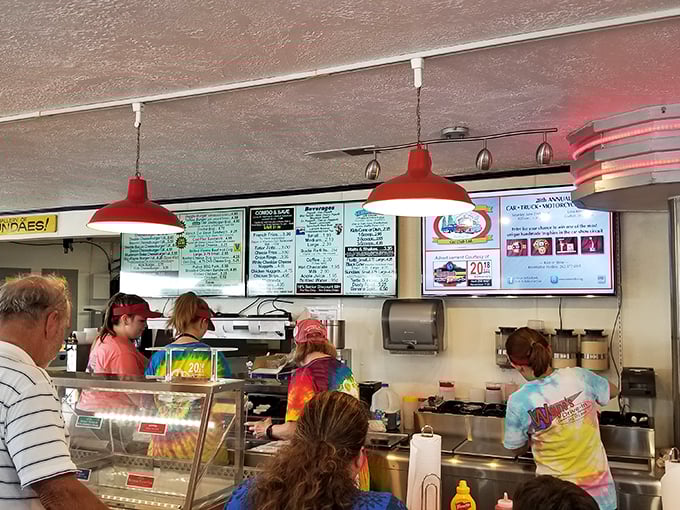Behind every great diner is a team that moves with practiced precision, turning orders into edible joy beneath the glow of vintage menu boards.