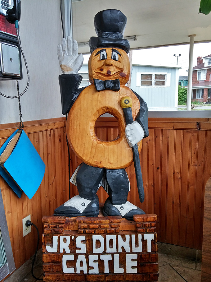 Meet the unofficial mayor of Donut Castle&mdash;a wooden gentleman who tips his hat to tradition while standing guard over generations of sweet memories.