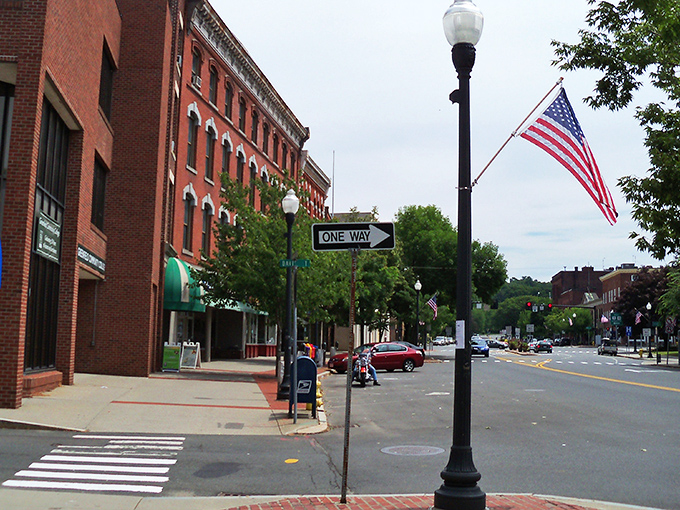 American flags flutter along Main Street, where historic lampposts and pedestrian-friendly sidewalks create a Norman Rockwell vision of affordable small-town life.