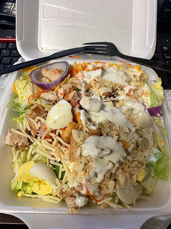 The takeout container that proves The Blue Plate doesn't skimp, even when you're eating elsewhere. That's a salad with ambition.