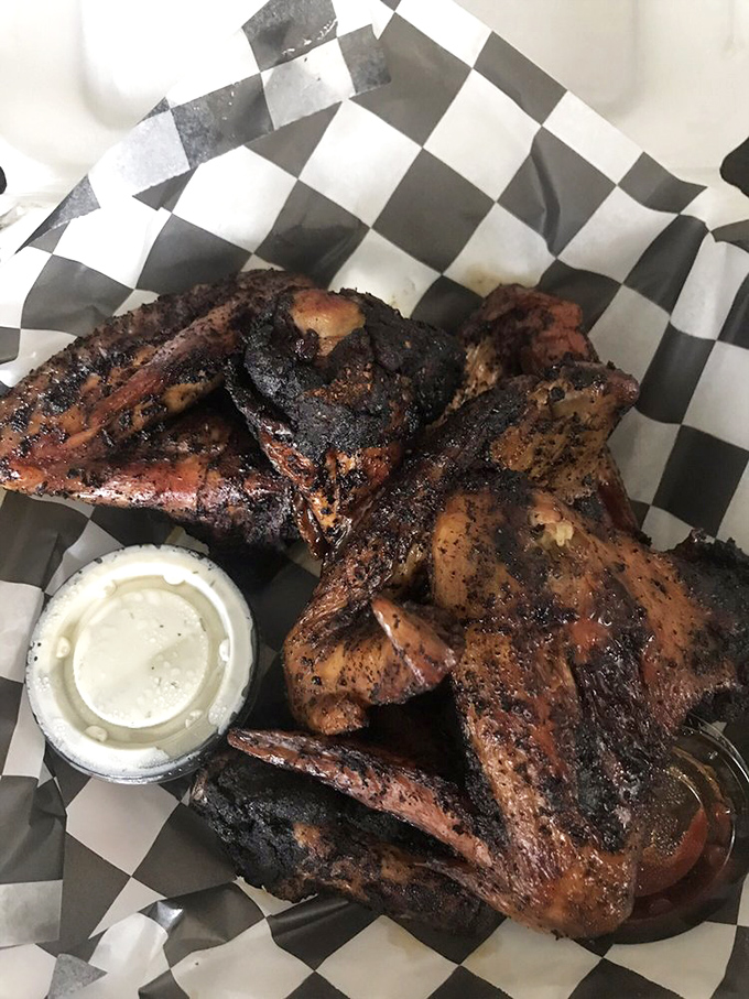 The smoker—where magic happens daily. These racks of meat are undergoing the slow, patient transformation that separates good BBQ from life-changing BBQ.