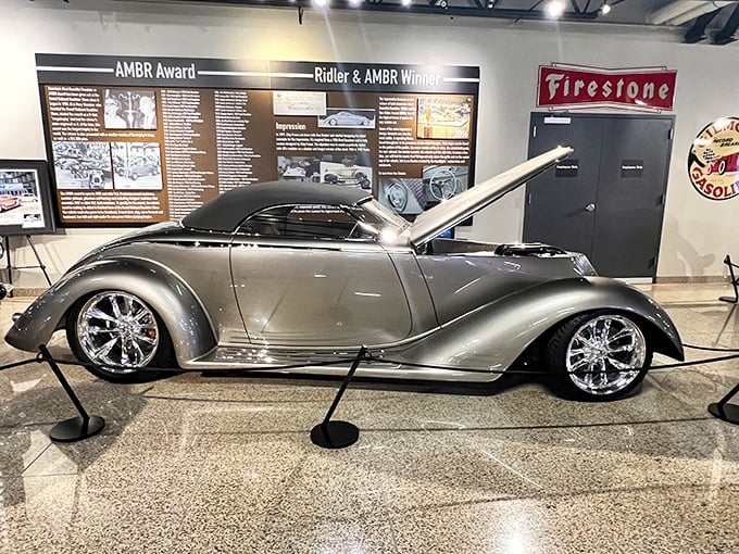 Streamlined perfection! This 1936 Ford Roadster showcases the art of customization with its sleek silver body and flowing lines that would make any hot rod enthusiast weak in the knees.