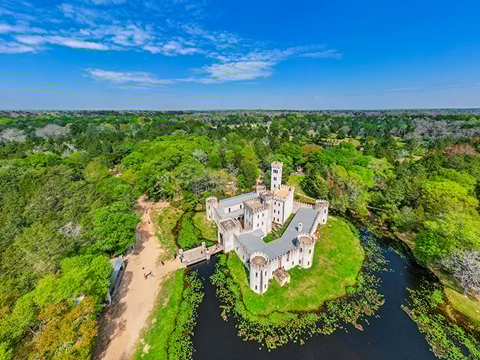 A bird's-eye view reveals the castle's impressive scale and perfect moat positioning. Medieval defensive strategy meets Texas-sized ambition.