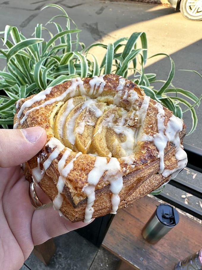 Icing drizzled like abstract art over a cinnamon-spiced canvas&mdash;this danish isn't just breakfast, it's morning motivation in pastry form.