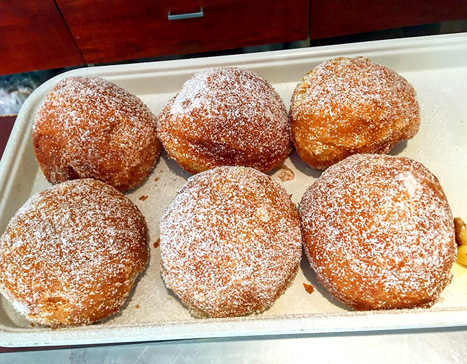 This cream-filled pastry isn't just dessert; it's therapy in edible form, with a blackberry crown that makes it almost too pretty to eat. Almost.