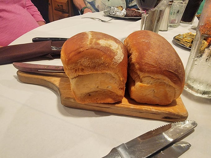 Bread that means business. These golden-brown loaves aren't mere table fillers—they're essential tools for sopping up every last drop of au jus.