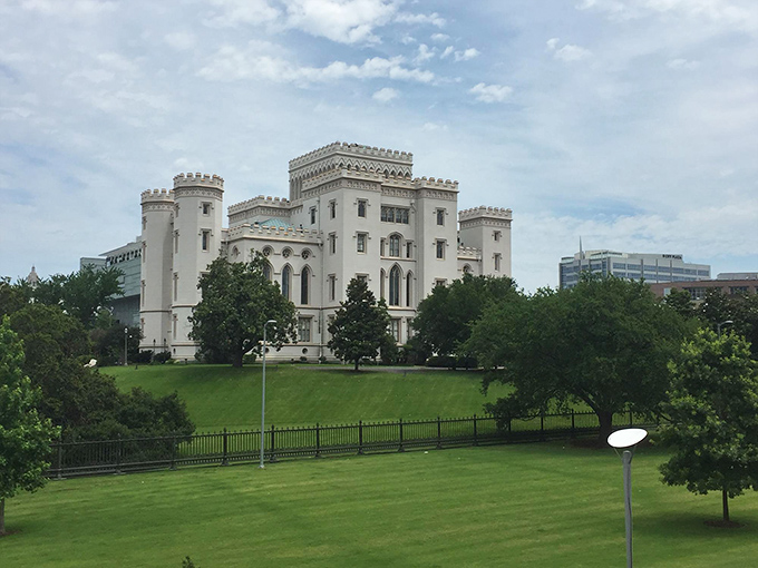 From this vantage point, the castle-like silhouette stands in striking contrast to modern Baton Rouge, a Gothic fantasy amid office buildings.