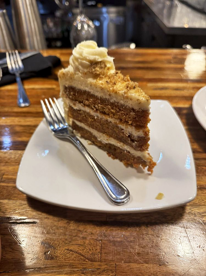 Layer upon layer of moist carrot cake separated by rich frosting&mdash;architecture you can eat. The dollop on top isn't excess; it's a well-deserved crown.