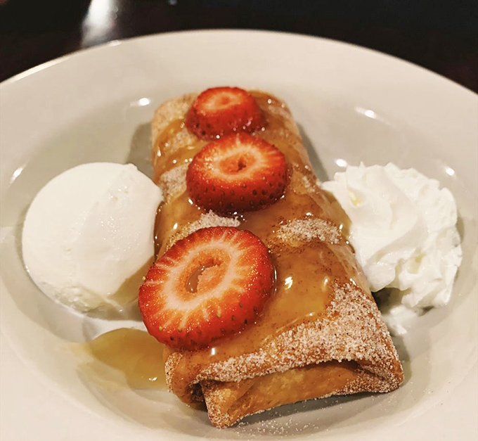 Dessert brilliance: a cheesecake chimichanga with fresh strawberries that answers the question, "Can chimichangas be dessert?" with a resounding "&iexcl;S&iacute;!"