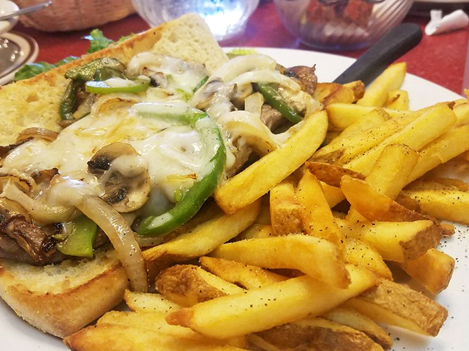 This sandwich isn't messing around &ndash; it's serious about melted cheese and those fries look like they've been training for this moment their entire potato lives.