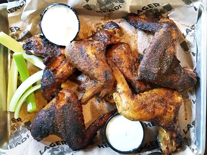 Smoke-kissed chicken wings with their burnished skin and two dipping options&mdash;because important decisions should always involve sauce.