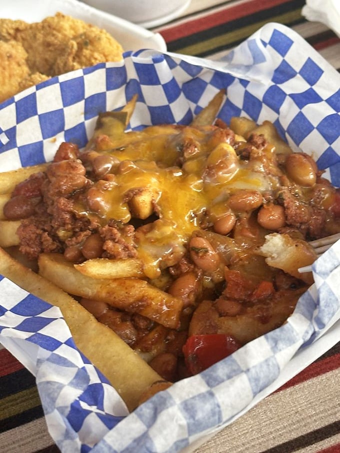 Chili cheese fries that laugh at dainty portions. This basket of decadence demands to be shared, but you won't want to.