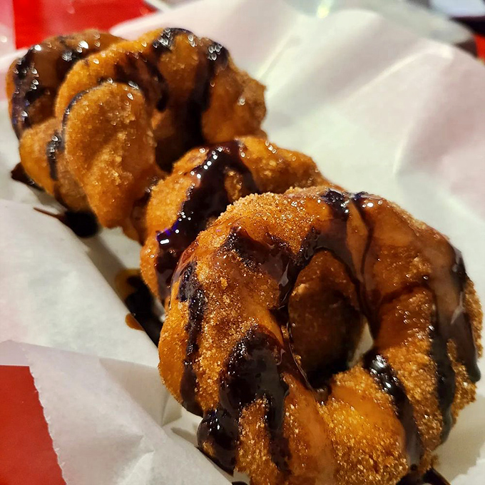 Churros got all dressed up for the occasion, drizzled in chocolate and dusted with cinnamon sugar &ndash; dessert that demands to be noticed. 