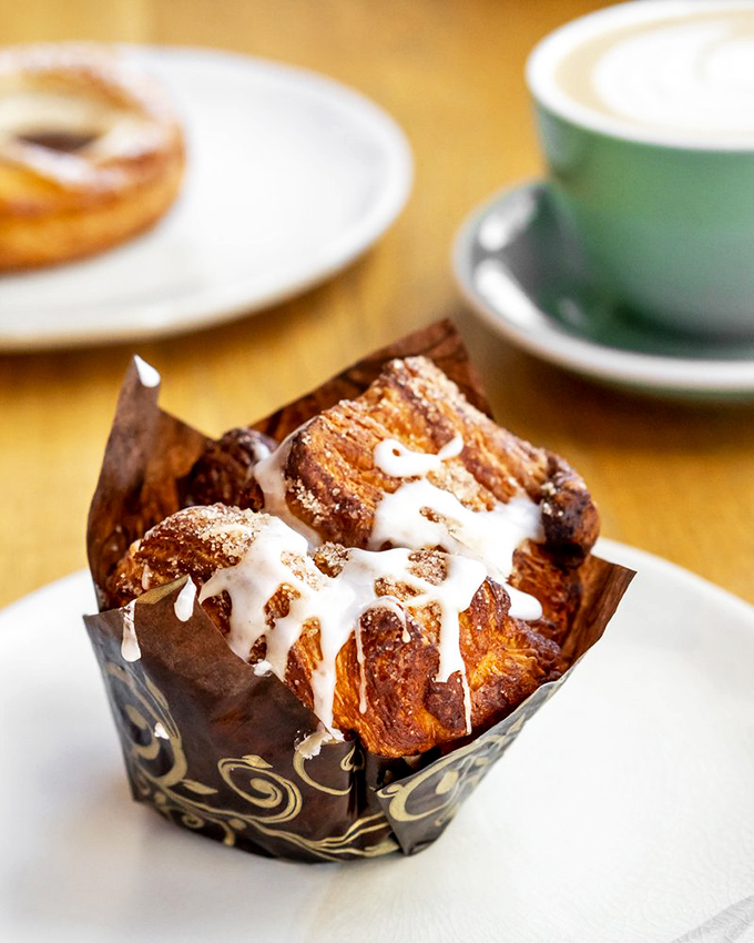 Cinnamon roll or edible artwork? The glaze dripping down those caramelized layers tells a story sweeter than any dessert deserves to be.