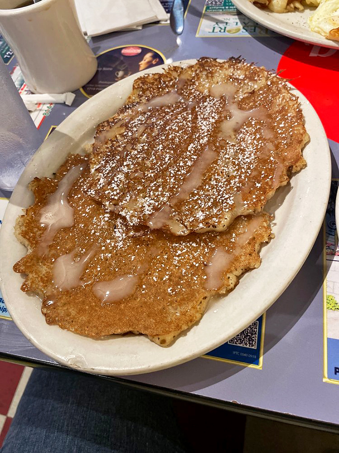These pancakes aren't just breakfast, they're dessert in disguise &ndash; golden-brown, cinnamon-infused discs of joy waiting for their maple bath.