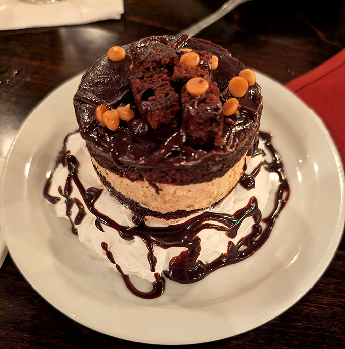 A chocolate dessert masterpiece that makes sharing difficult&mdash;strategic fork positioning may be required to ensure equal distribution.