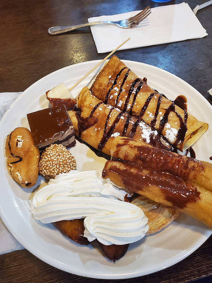 Dessert nirvana achieved: cream-filled pastries, chocolate-drizzled crepes, and whipped cream mountains. Diet resolutions come here to die a beautiful death.