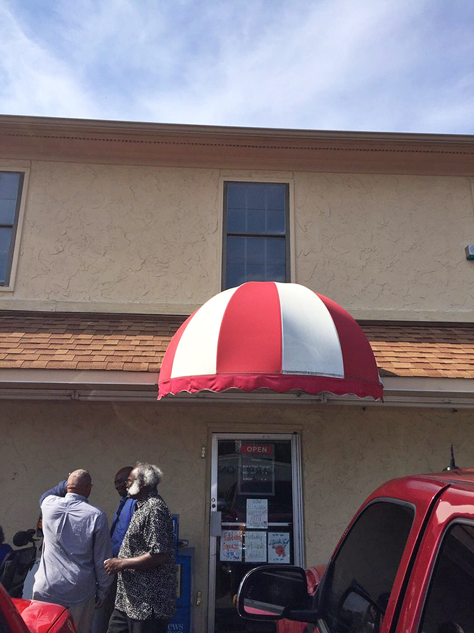 The red and white awning beckons like a carnival for your taste buds. The line of people knows: this is worth the wait.