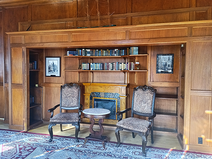 Two elegant chairs flank a fireplace in perfect symmetry, creating the ideal setting for plotting your next adventure or practicing your royal wave.