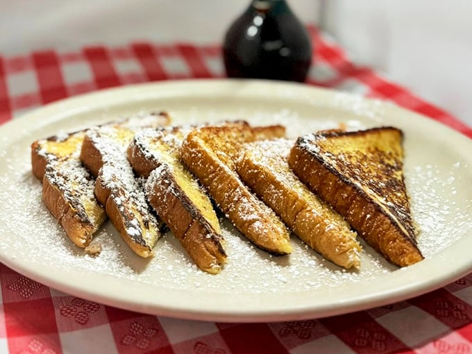 French toast dusted with powdered sugar like fresh snow on a winter morning&mdash;breakfast that doubles as dessert without a hint of apology.