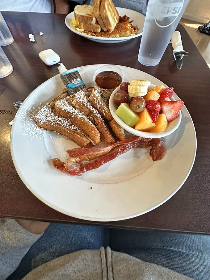 French toast that makes you question why you'd ever order anything else, dusted with powdered sugar and served with nature's candy.