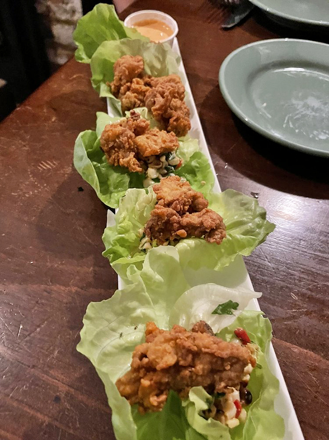Fried oysters in lettuce cups &ndash; the perfect marriage of crispy indulgence and "hey, I'm eating a vegetable!" self-deception. Genius in every bite.