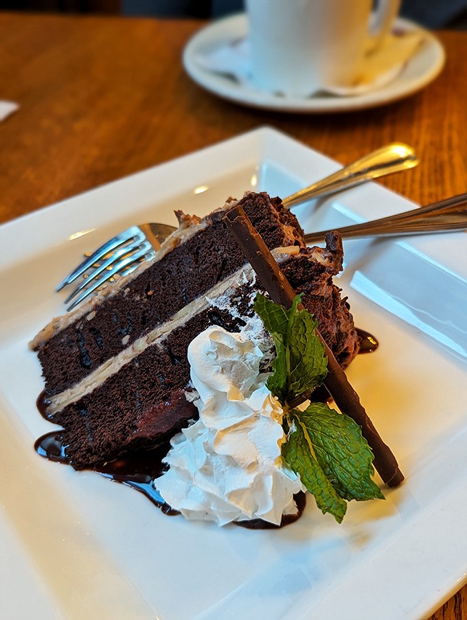 This isn't just chocolate cake&mdash;it's a layer-by-layer masterpiece of cocoa, cream, and childhood memories, wearing a mint leaf hat.