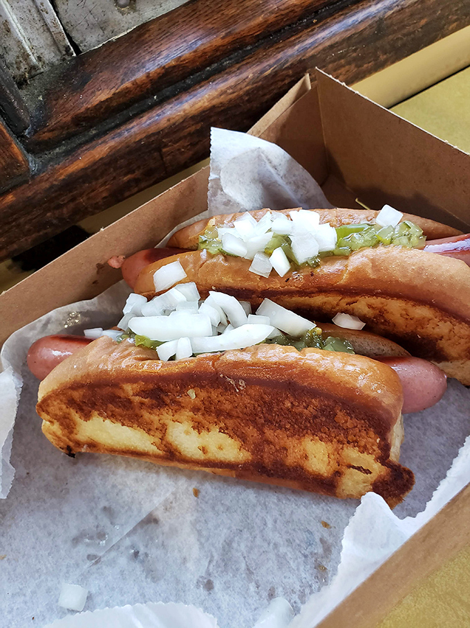These grilled dogs with their perfectly toasted buns prove that sometimes the most memorable meals come in the most unassuming packages.