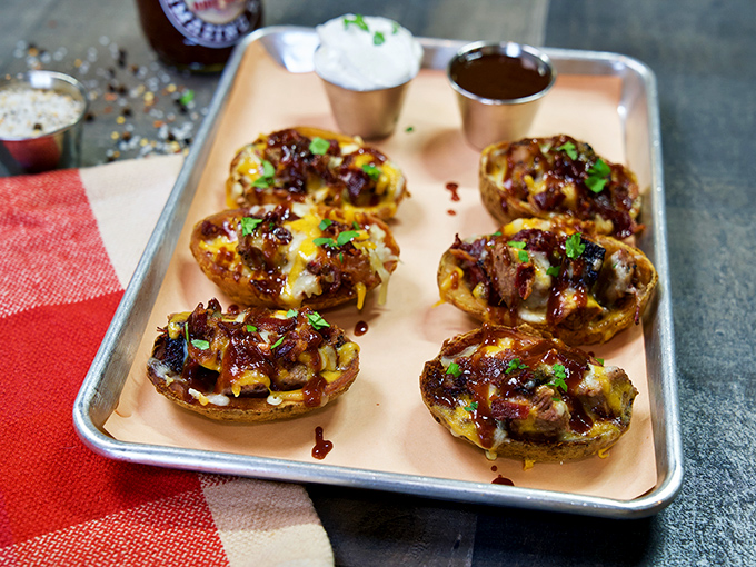 Loaded potato skins that make you wonder why they're not the main course. Each bite delivers a perfect ratio of crispy skin, melty cheese, and savory toppings.