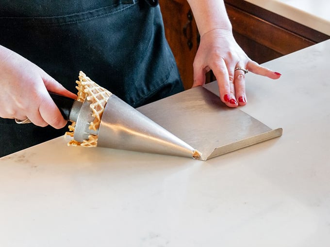 The sacred art of waffle cone creation &ndash; where batter becomes architecture in a matter of delicious seconds.