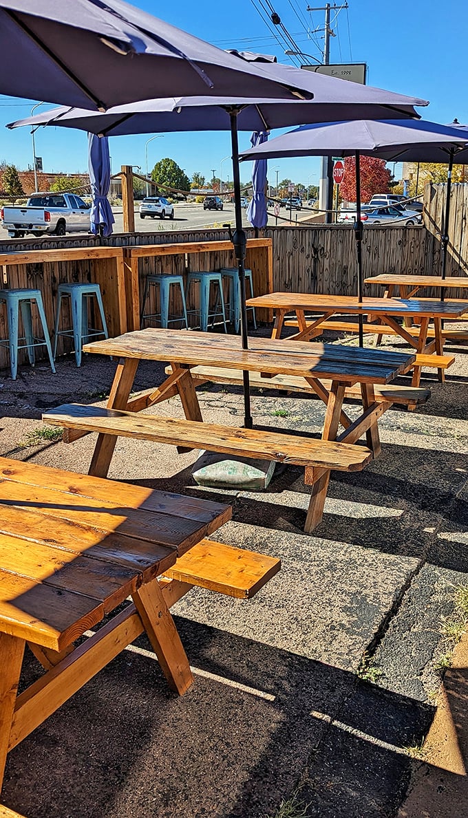 The outdoor patio with its blue umbrellas and wooden picnic tables offers a perfect spot for enjoying Greek delights under the famous New Mexico sky.