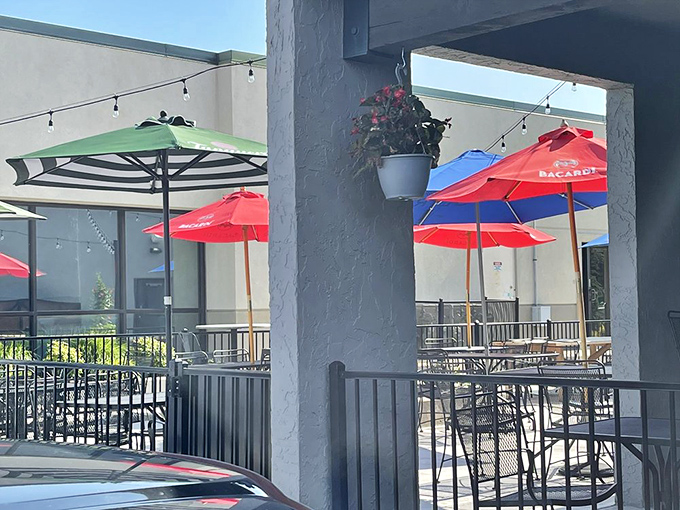 The outdoor patio beckons with colorful umbrellas and promise of fresh air. When Kansas weather cooperates, this becomes the hottest real estate in Wichita&mdash;no reservation app required.