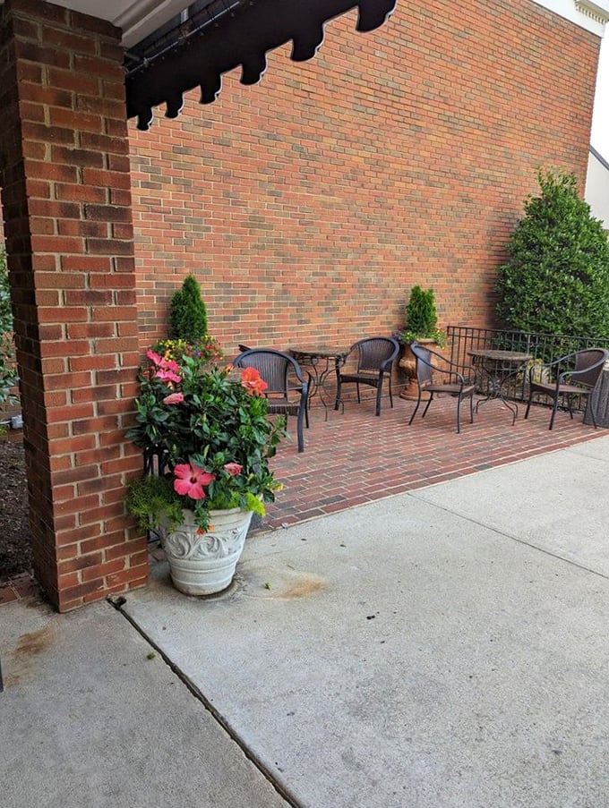 The outdoor seating area&mdash;where you can digest in peace while plotting your return visit. Those flowers aren't the only things blooming here.