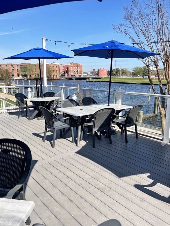 The outdoor deck isn't just a dining area—it's front-row seating to nature's own dinner theater, where the Wicomico River plays the starring role.