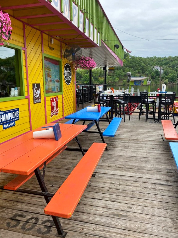 The outdoor deck where every table comes with a side of fresh air and lake views. Those colorful picnic tables are calling your name.