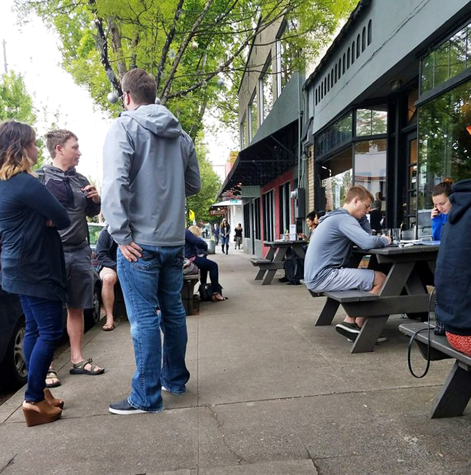 Portland's sidewalk dining scene at its finest. These wooden tables have witnessed first dates, friend reunions, and the silent contemplation of perfectly poached eggs.