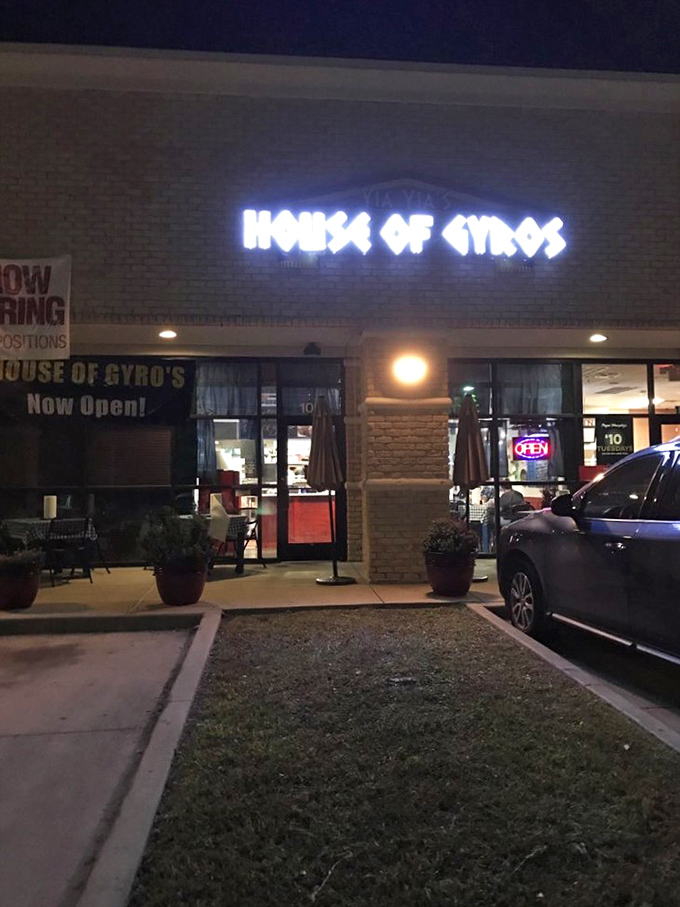 By night, the neon glow of Yia Yia's sign serves as a beacon for hungry souls seeking Mediterranean salvation in suburban Texas.