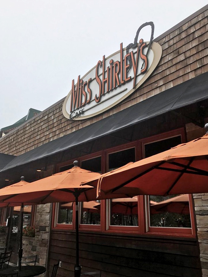 Rain or shine, those orange umbrellas stand guard like sentinels protecting the temple of breakfast. Some pilgrimages are worth making regardless of weather.