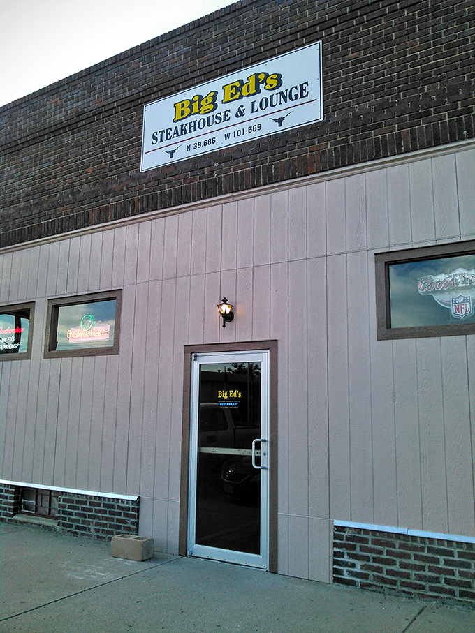 As evening falls on Bird City, the glow from Big Ed's windows beckons like a lighthouse for the hungry, promising safe harbor from mediocre meals.