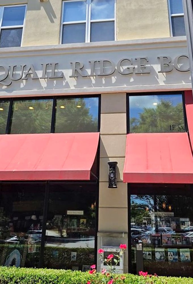 The exterior may be understated, but those crimson awnings signal what locals already know: literary magic happens behind these windows.