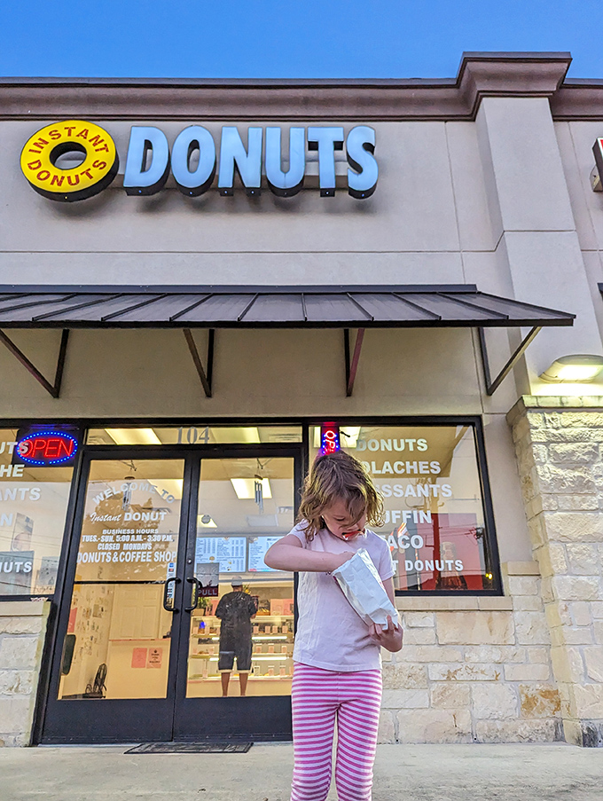 The exterior at dusk takes on a warm glow, as if the building itself is proud to house such beloved breakfast treasures.