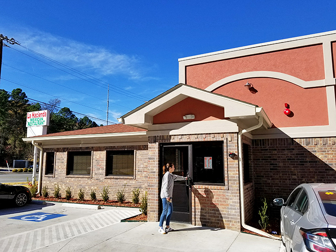 The entrance beckons like a portal to flavor country—step through these doors and leave your diet resolutions in the parking lot.
