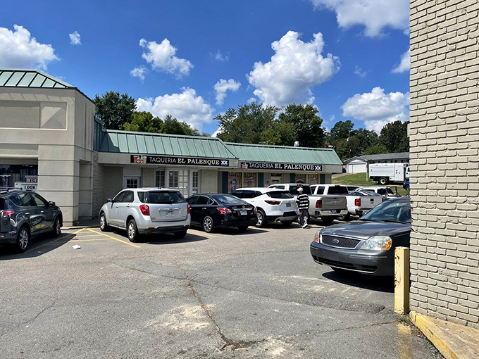 The parking lot view that Arkansas food enthusiasts have memorized. Cars gathered like pilgrims at a temple of authentic flavors. 