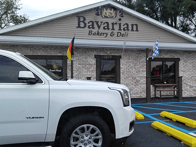 Your chariot awaits! The German and Bavarian flags flutter in welcome, beckoning carb enthusiasts to pull in for pretzel perfection.