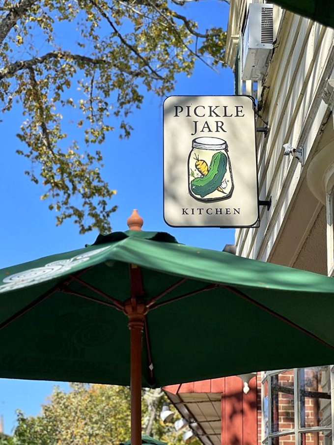 The iconic Pickle Jar sign swings gently above Main Street, a beacon for hungry travelers and a symbol of Falmouth's delicious hidden treasures.