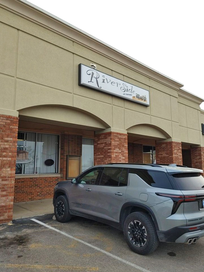 Riverside Cafe's exterior might not stop traffic, but the parking lot tells the real story. Where locals know to find honest-to-goodness goodness.