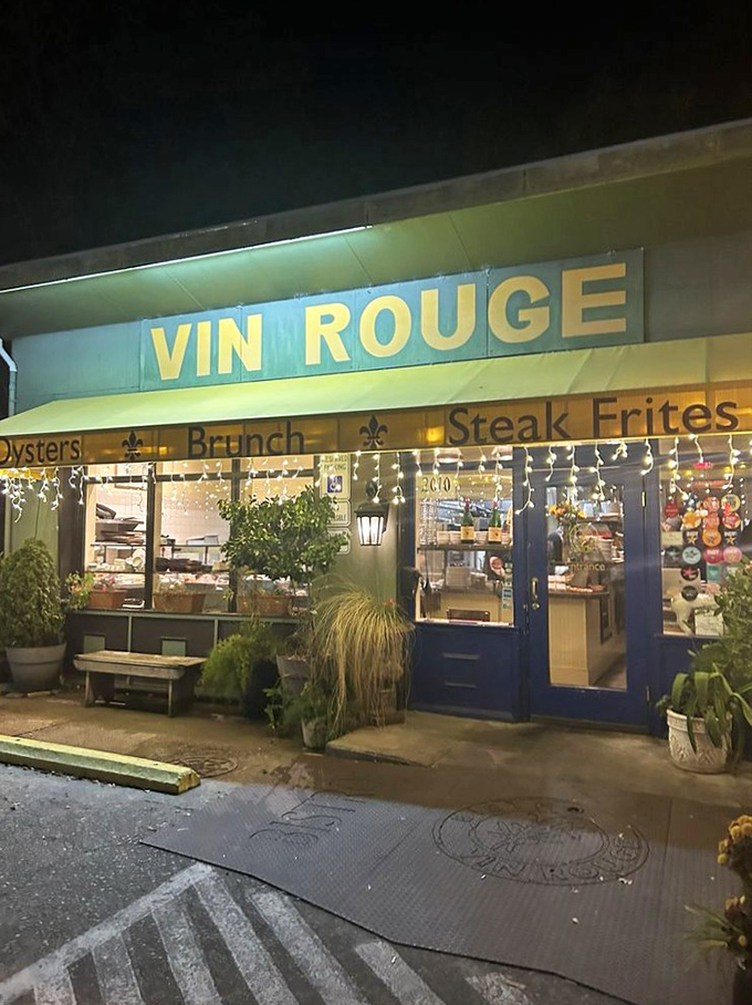 As night falls, the yellow glow of Vin Rouge becomes a beacon for hungry travelers and locals alike—promising French comfort on American soil.