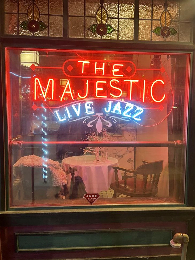 The neon sign glows like a lighthouse for hungry souls seeking refuge from chain restaurant mediocrity. Jazz and jubilation await inside.