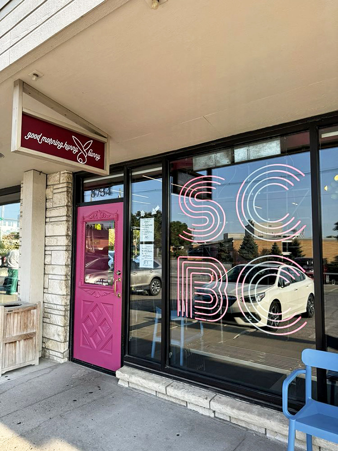 The exterior may be unassuming, but that pink door and neon sign whisper sweet promises of the breakfast nirvana waiting inside. 