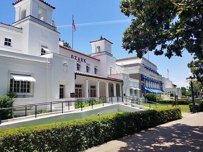 The pristine white Ozark Bathhouse gleams in the sunshine, looking like it's waiting for a time-traveling F. Scott Fitzgerald to stroll through its doors.